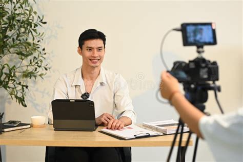 Successful Young Entrepreneur Speaking On Camera During Office