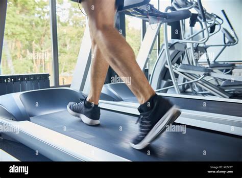 Unrecognizable Man Running On Treadmill Stock Photo Alamy