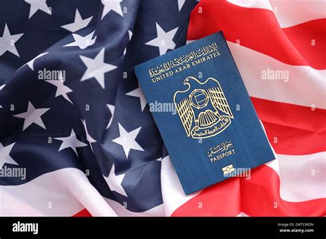 Blue United Arab Emirates Passport On United States National Flag