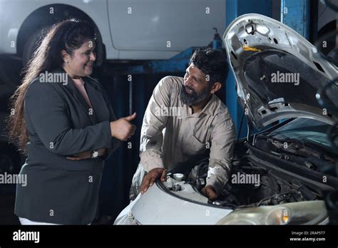Portraying Customer Trust And Satisfaction Towards The Service Station Standing With A Car