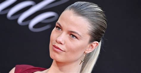 Hailey Clauson Flaunts Legs For Days Pairs Black Mini Dress With Chunky White Sneakers Sports