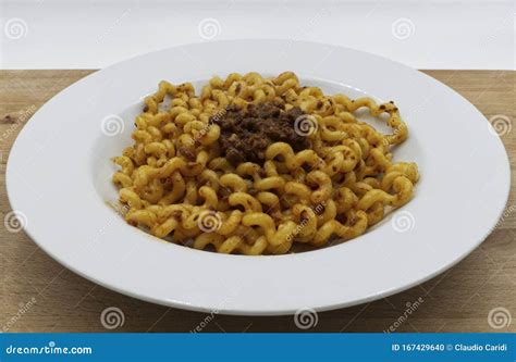 Fusilli Lunghi Bucati With Bolognese Sauce On A White Plate Wooden