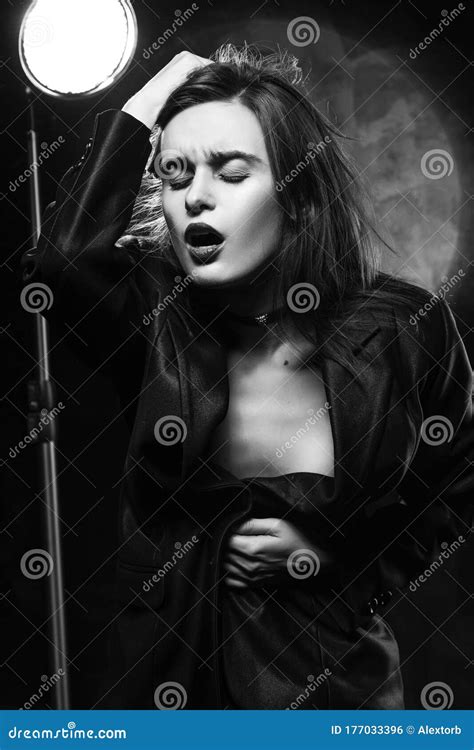 Beautiful Slim Braless Girl Wearing A Unbuttoned Black Blazer