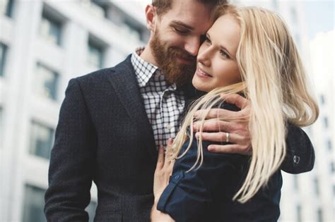 Premium Photo Man Hugging His Girlfriend At Street