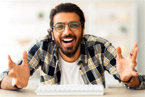 Emotional Middle Eastern Guy Freelencer Having Conference With Someone
