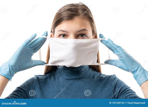 Beautiful Female Doctor Or Nurse Wearing Protective Mask And Latex Or