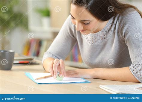 Woman Erasing With Rubber On A Desk At Home Stock Image Image Of Desktop Edit 184970269