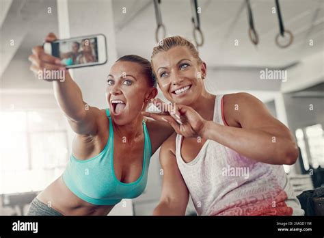 Because Gym Selfies Arent Optional Two Young Women Taking A Selfie At