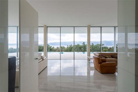 Turato Architects Embeds Angular Bedrock House Into Hillside Of