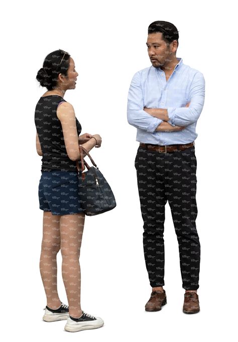 Two People Standing And Talking Indoors Vishopper