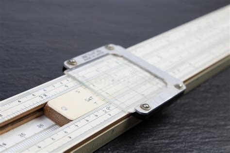 Logarithmic Ruler On Black Background Stationery For Engineers And