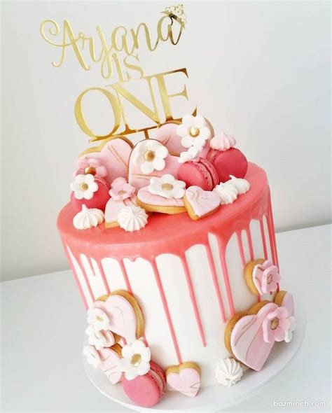 کیک زیبای تولد یکسالگی دخترانه با تم سفید و صورتی
