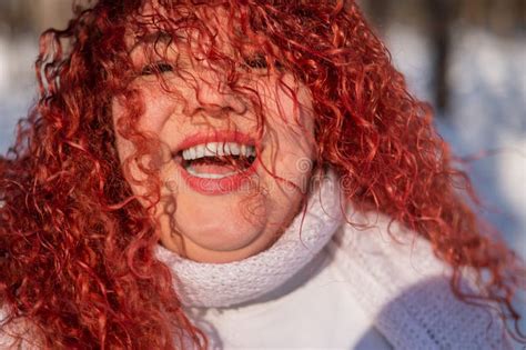 Portrait Of A Smiling Chubby Red Haired Woman On A Walk In Winter Stock Photo Image Of Lady