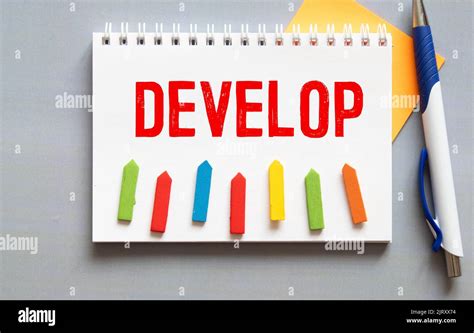 Develop Word Written On Wood Block Develop Text On Cement Table For Your Desing Concept Stock