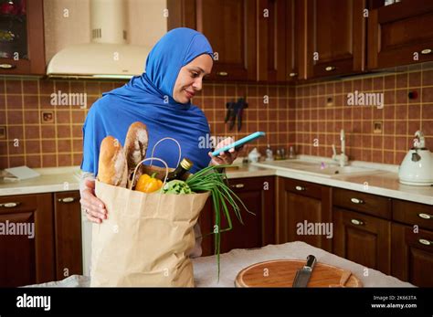 Pleasant Muslim Housewife In Hijab Returns Home After Grocery Shopping