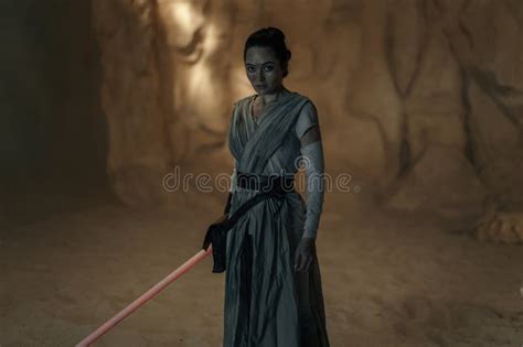 Cosplayer Girl Portrays Character Rey Skywalker From The Star Wars