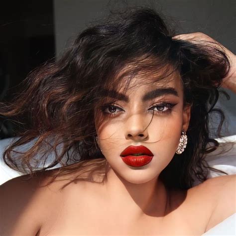 An Image Of A Woman With Red Lipstick