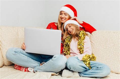 Premium Ai Image Young Mother And Her Daughter Dressed In Santa Claus