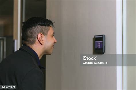 Man Using Face Scanner To Unlock Door In Office Building Access Control