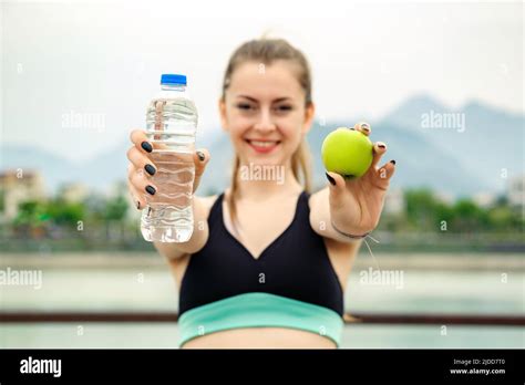 Young Brunette Girl Smiling Happy Wearing Sportive Clothes On City Park