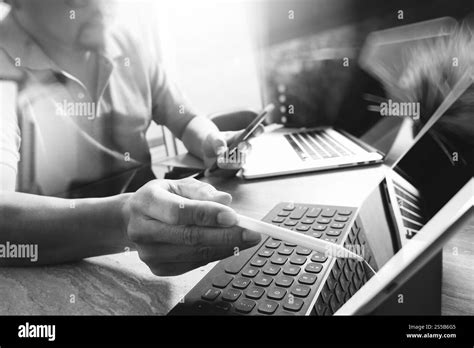 outsource developer working on marble desk working laptop computer