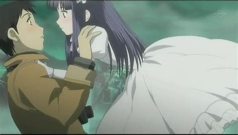 Two Anime Characters Standing Next To Each Other In Front Of Green And