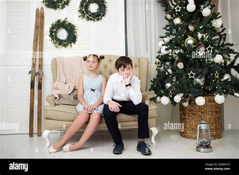 The Tortured Brother And Sister Are Sitting On The Couch By The