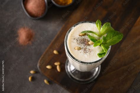 Indian Salty Lassi With Mint Leaves And Kala Namak On Black Background