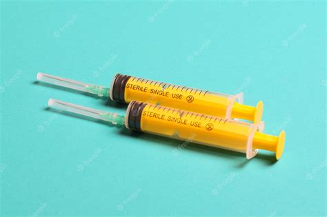 Premium Photo Top View Of Different Syringes For Injection On