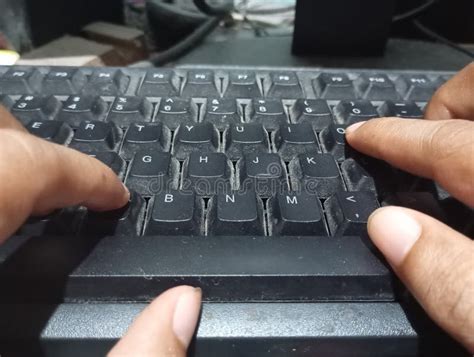 Data Entry With Hands Typing On A Keyboard Working On The Computer