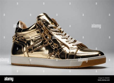 A Luxurious Sneaker Featuring Gold Metallic Accents And Embellishments