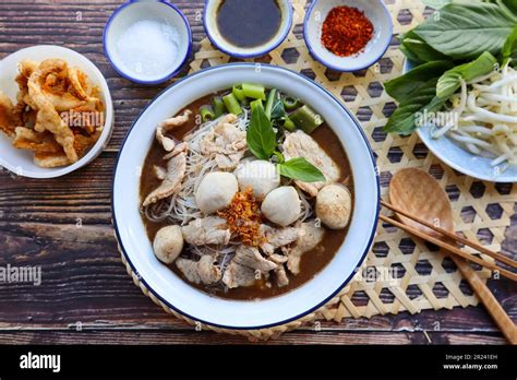 Thai Style Noodle Soup Served With Vegetable Flat Lay On Wood Table