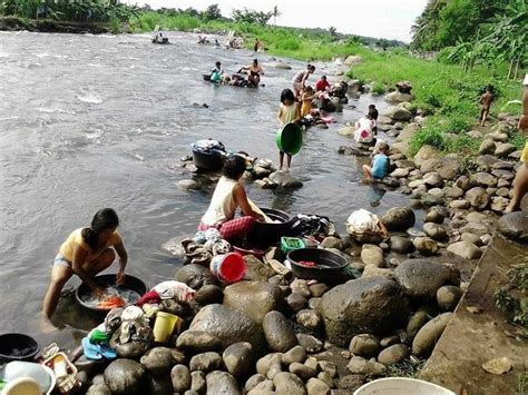 Washing Clothes In The River