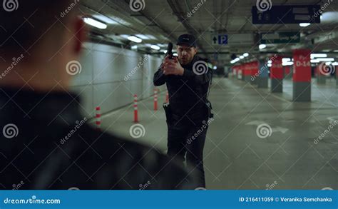 Policeman Arresting Criminal At Operation Male Cop Aiming Suspect With