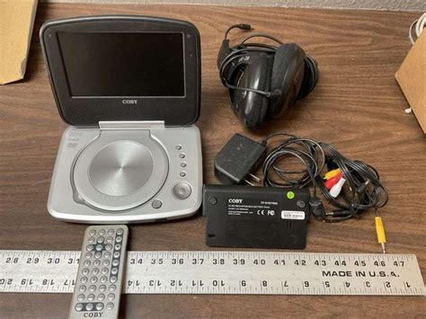 Coby Portable Dvdcd Player And Accessories Legacy Auction Company