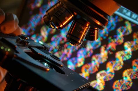 Scientific Exploration Depicted Through A Microscope Viewing Colorful Dna Sequences Emphasizing