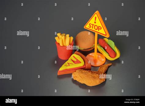 Closeup Image Of Stop Signboard And Junk Foods Stop Eating Unhealthy