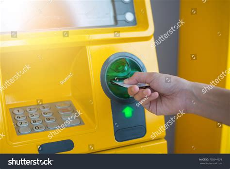 Hand Inserting Atm Card Into Bank Stock Photo Shutterstock