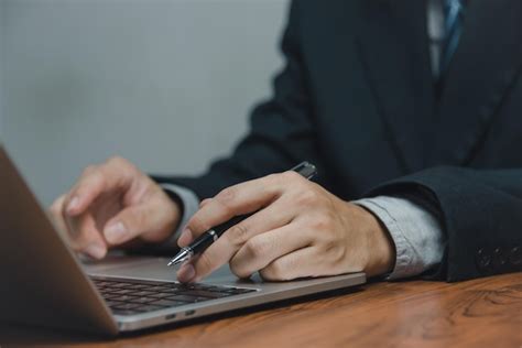 Premium Photo Close Up Man Working And Typing On Laptop Computer