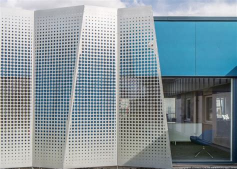 Perforated Metal Covers The Facade Of This Office Extension