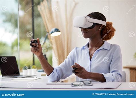 Woman Working From Home Office With Controllers Wearing VR Headset