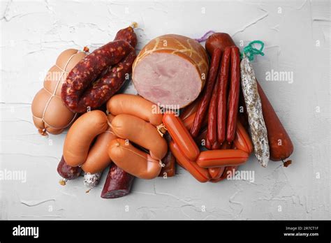 Different Types Of Sausages On White Textured Table Flat Lay Stock Photo Alamy
