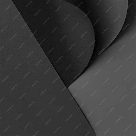 濃い灰色の背景にカールした黒いチャート紙 無料の写真