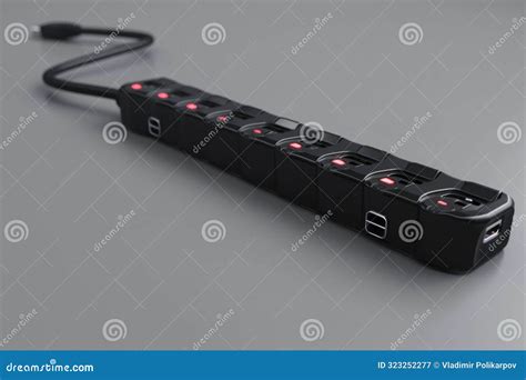 A Standard Power Strip With Red Indicator Lights Suitable For Various Settings Stock Image