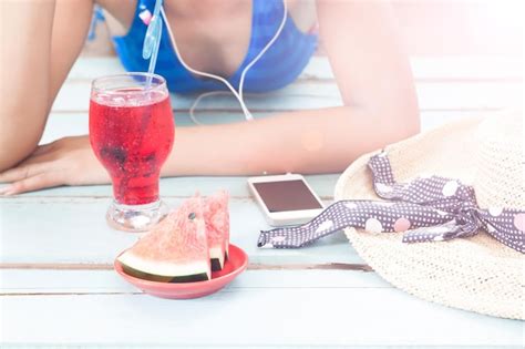 Premium Photo Midsection Of Woman In Bikini Relaxing By Food And