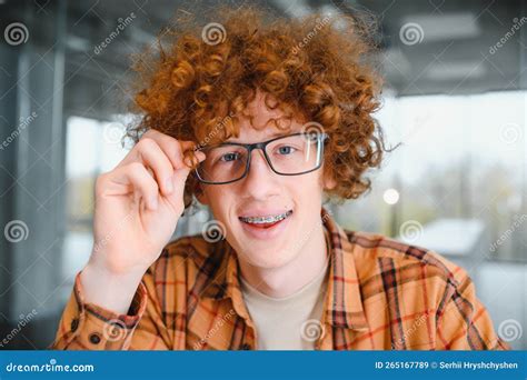Cute Red Haired Guy Wearing Stylish Glasses Yellow T Shirt Stock Image