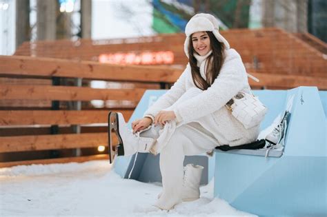 Premium Photo Excited Brunette Girl In White Pants White Fur Coat