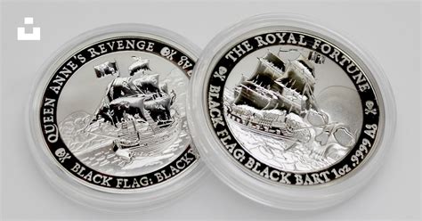 2 Round Silver Coins On White Surface Photo Free Coin Image On Unsplash