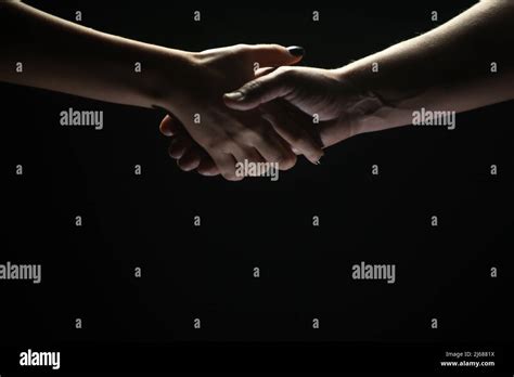 Handshake Between The Two Partners Rescue Or Helping Gesture Of Hands