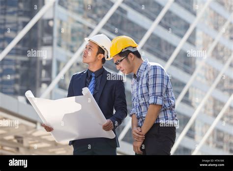 Architect Engineer Project Manager Or Businessman Point To Building